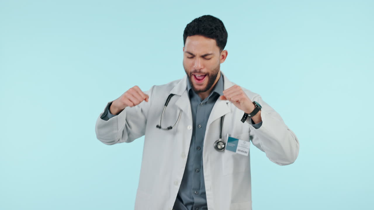Premium stock video - Medical doctor, dancing and man in studio for fun