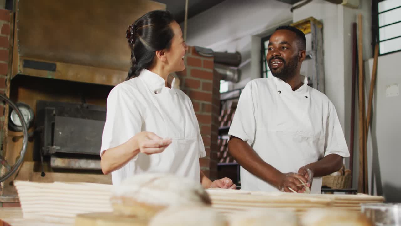 Premium stock video - Animation of happy diverse female and male bakers ...