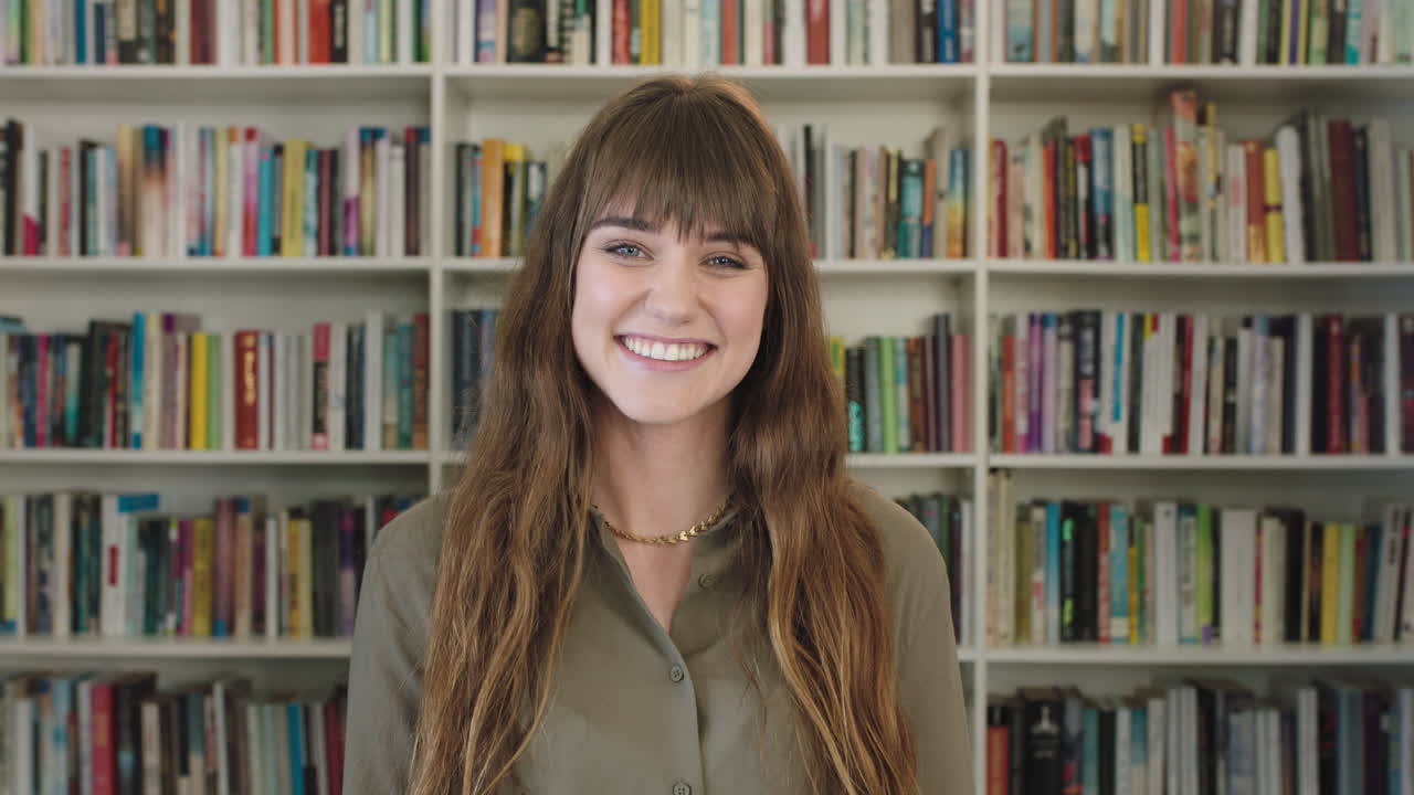 Portrait of young pretty librarian woman smiling happy looking at ...