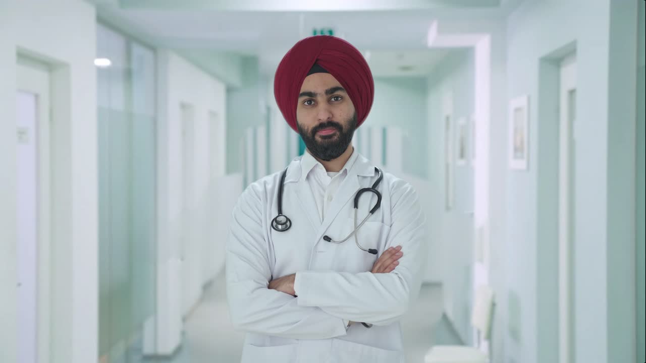 Confident Sikh Indian doctor standing crossed hands | Premium Stock ...