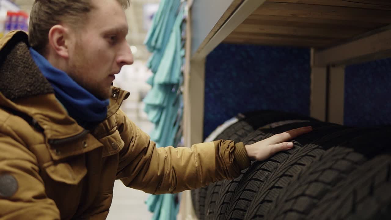 Man choosing new tires in shot and counting them | Premium Stock Video ...