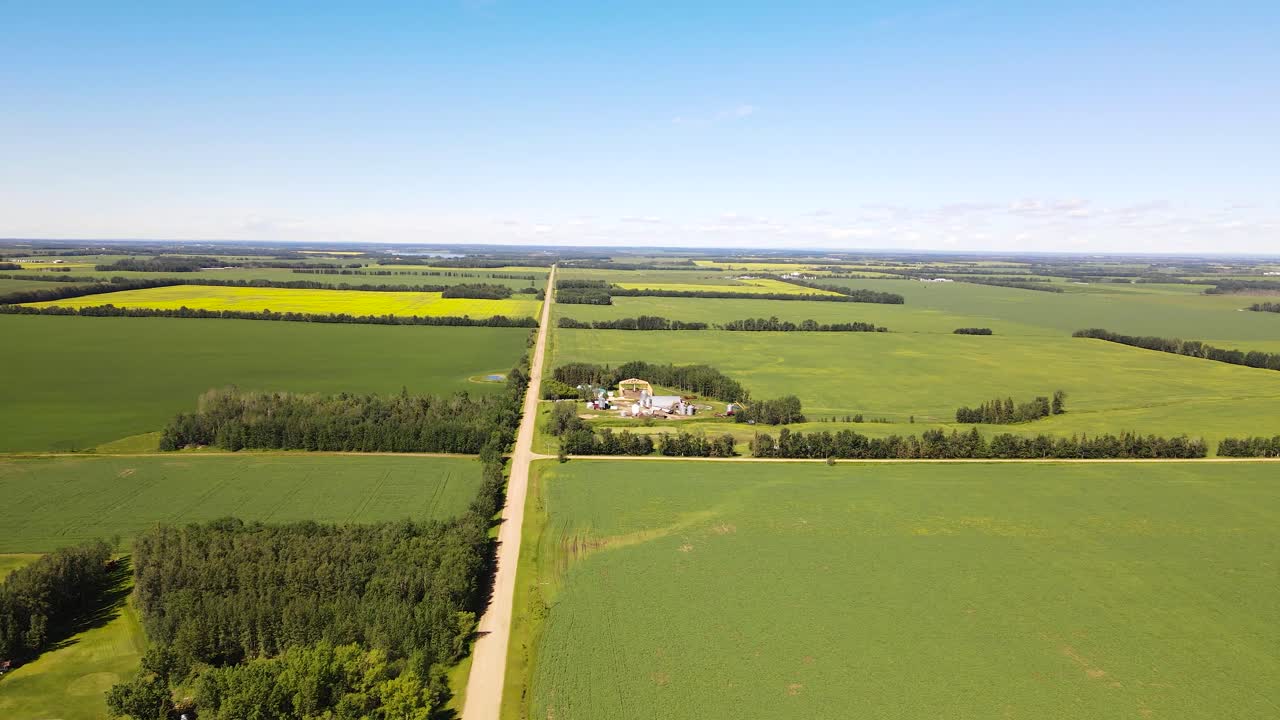 Premium stock video - Alberta country side with road and acreages