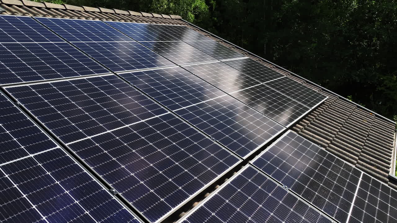 Premium stock video - Flying close to the reflecting surface of rooftop ...