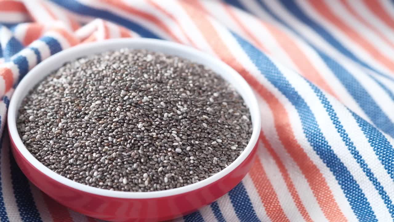 Chia Seeds in a Red Bowl | Premium Stock Video Footage