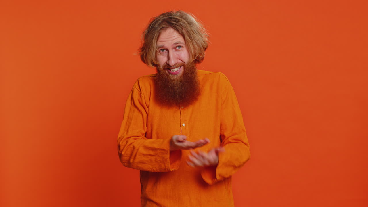 Confused caucasian man pointing at camera showing stupid asking for ...