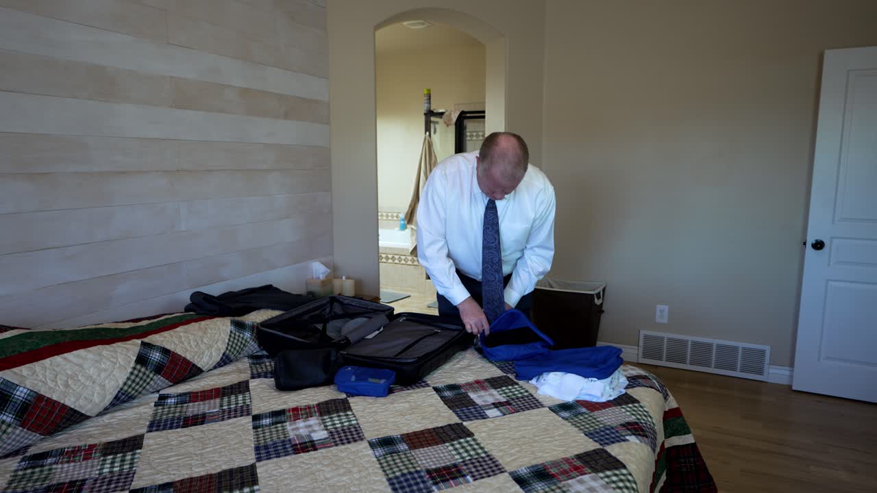 Executive Older Man Using Packing Cubes To Organize Items In His ...
