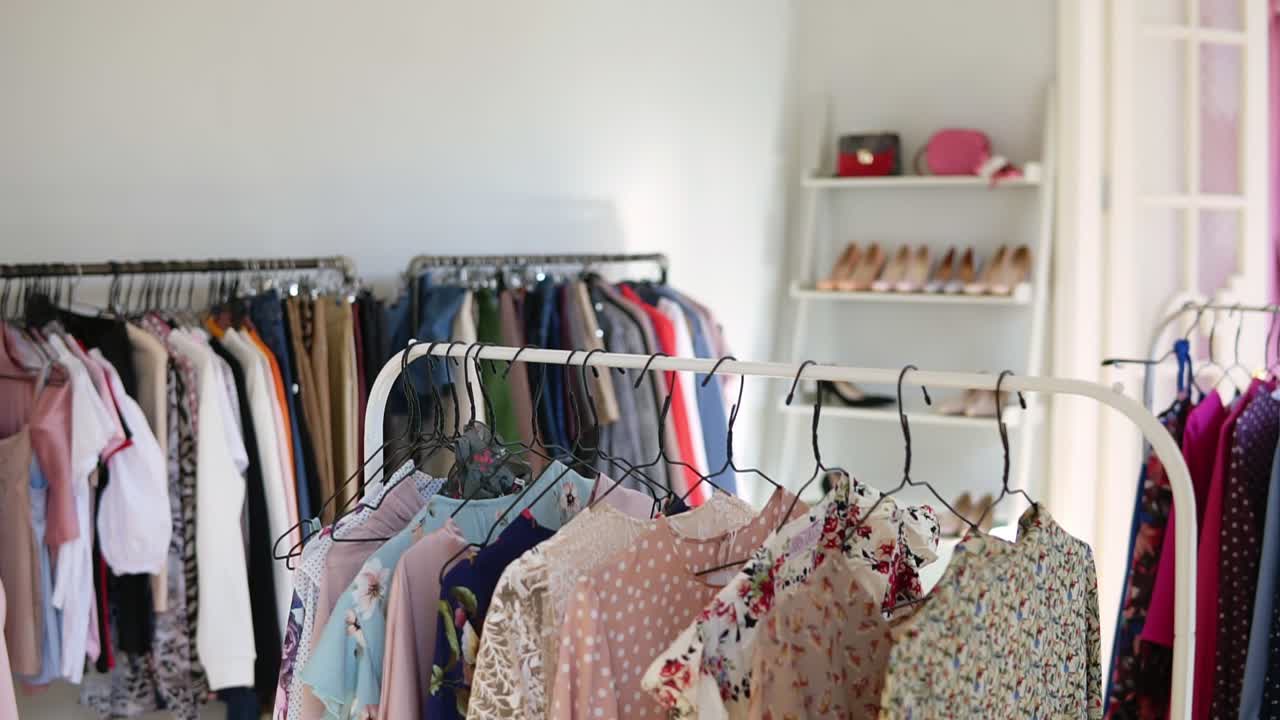 Free stock video - Footage of clothing dress rack with hangers and ...
