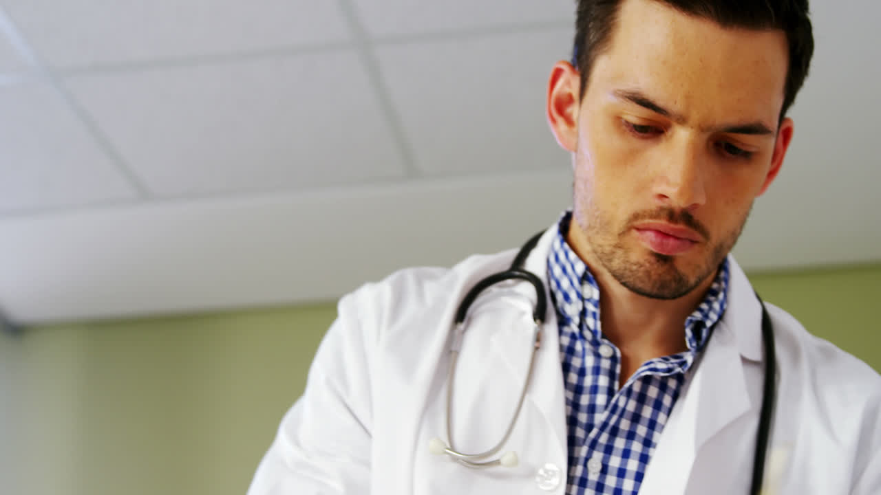 Doctor checking a medical report | Premium Stock Video Footage