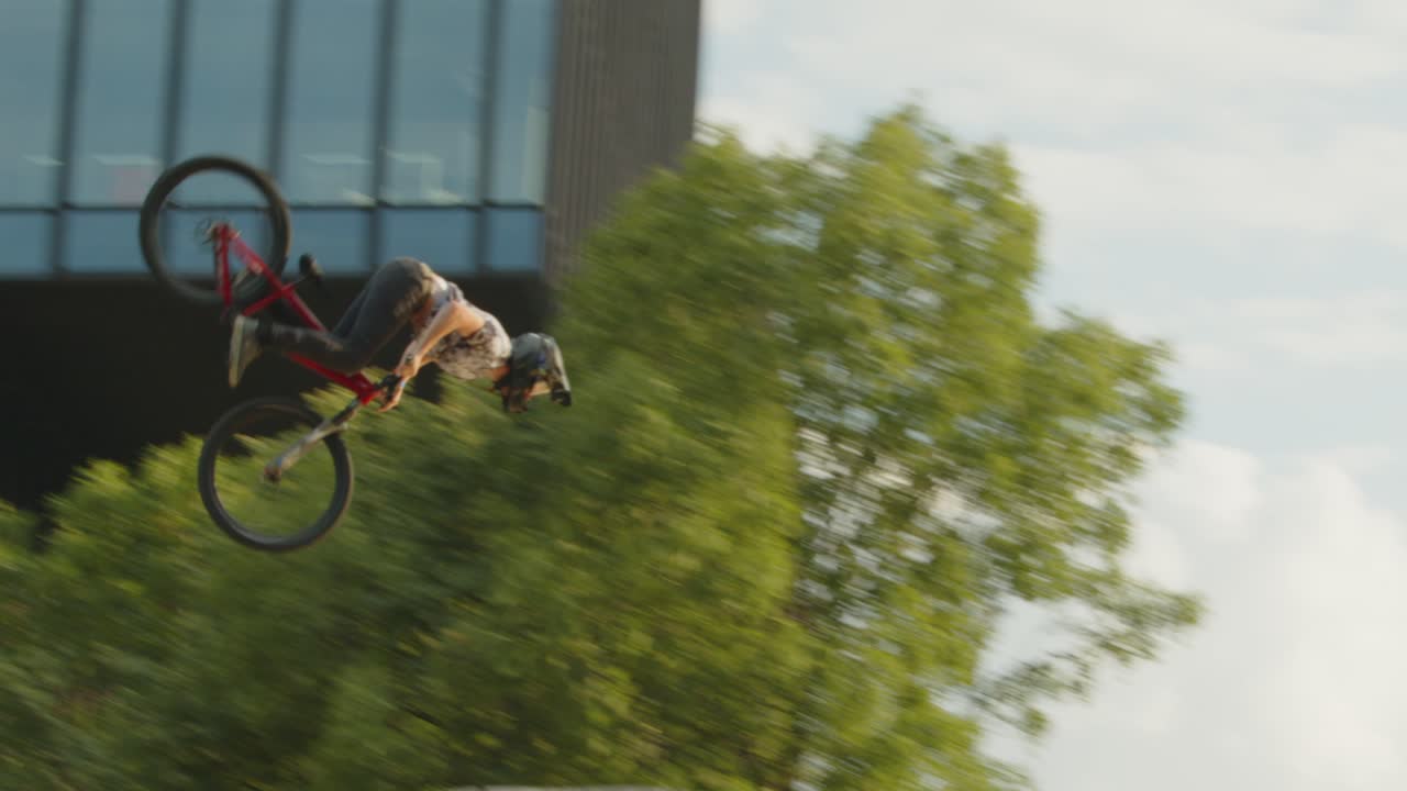 Premium stock video - Huge bmx backflip trick done off of a jump in ...