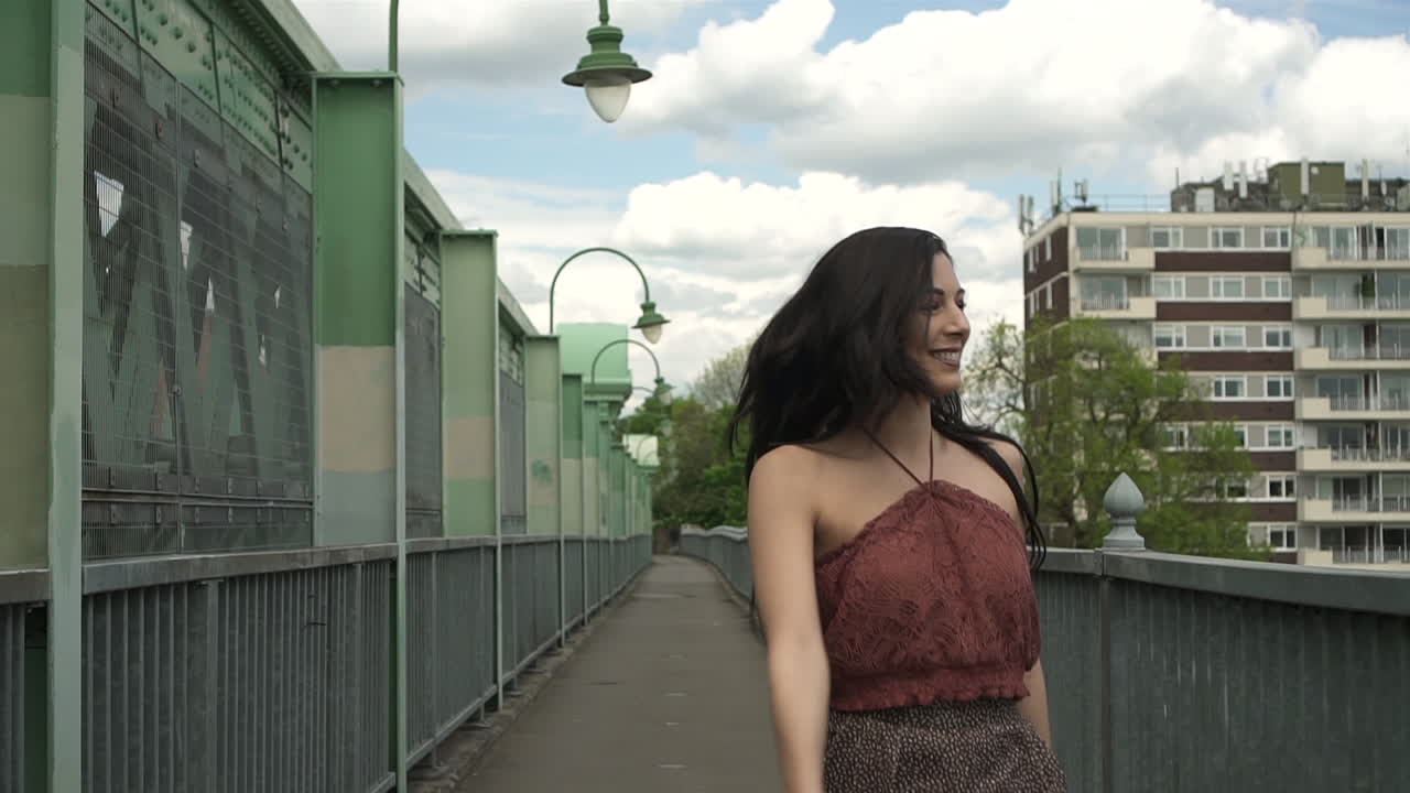 Premium stock video - Happy and carefree latina woman throwing her ...