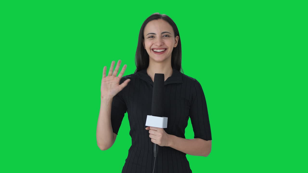 Happy Indian Female News Reporter Waving Hello Green Screen Free Stock ...