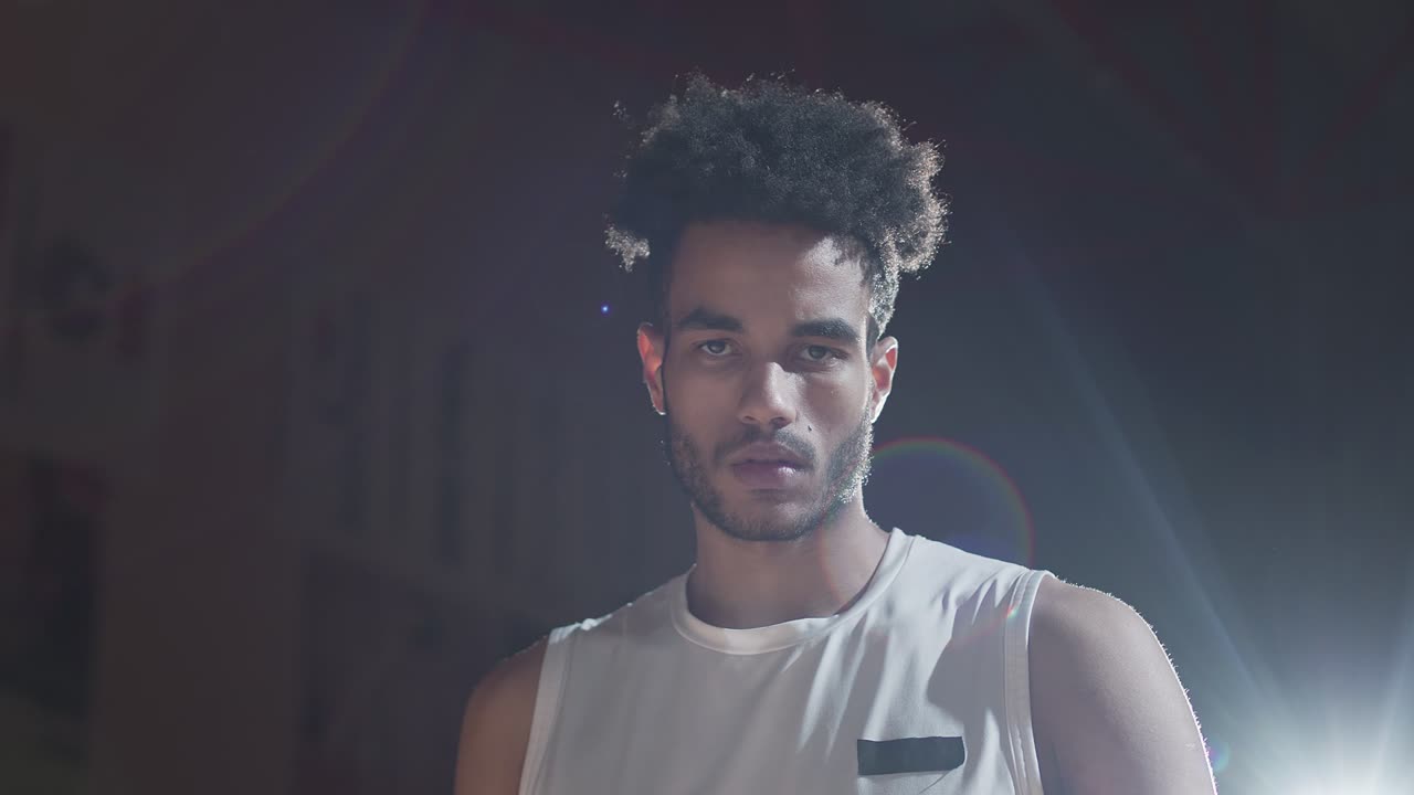 Free stock video - Young man basketball player looking at camera