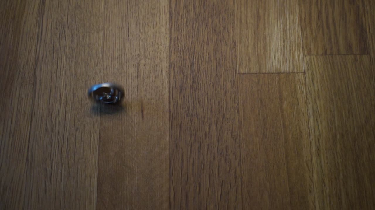 Premium stock video - Rotating coin on a wodden table-15