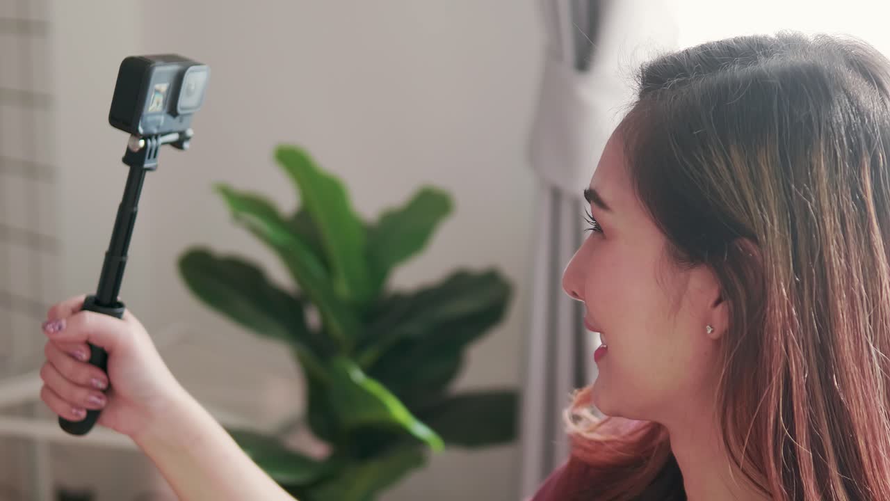 Premium stock video - Tourism blogger recording video selfie talk with ...