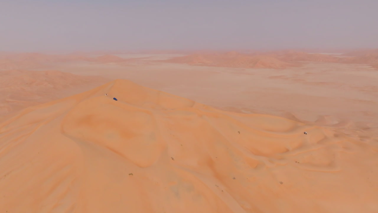Endless desert dunes in Oman, vast and empty under extreme summer heat | Premium Stock Video Footage