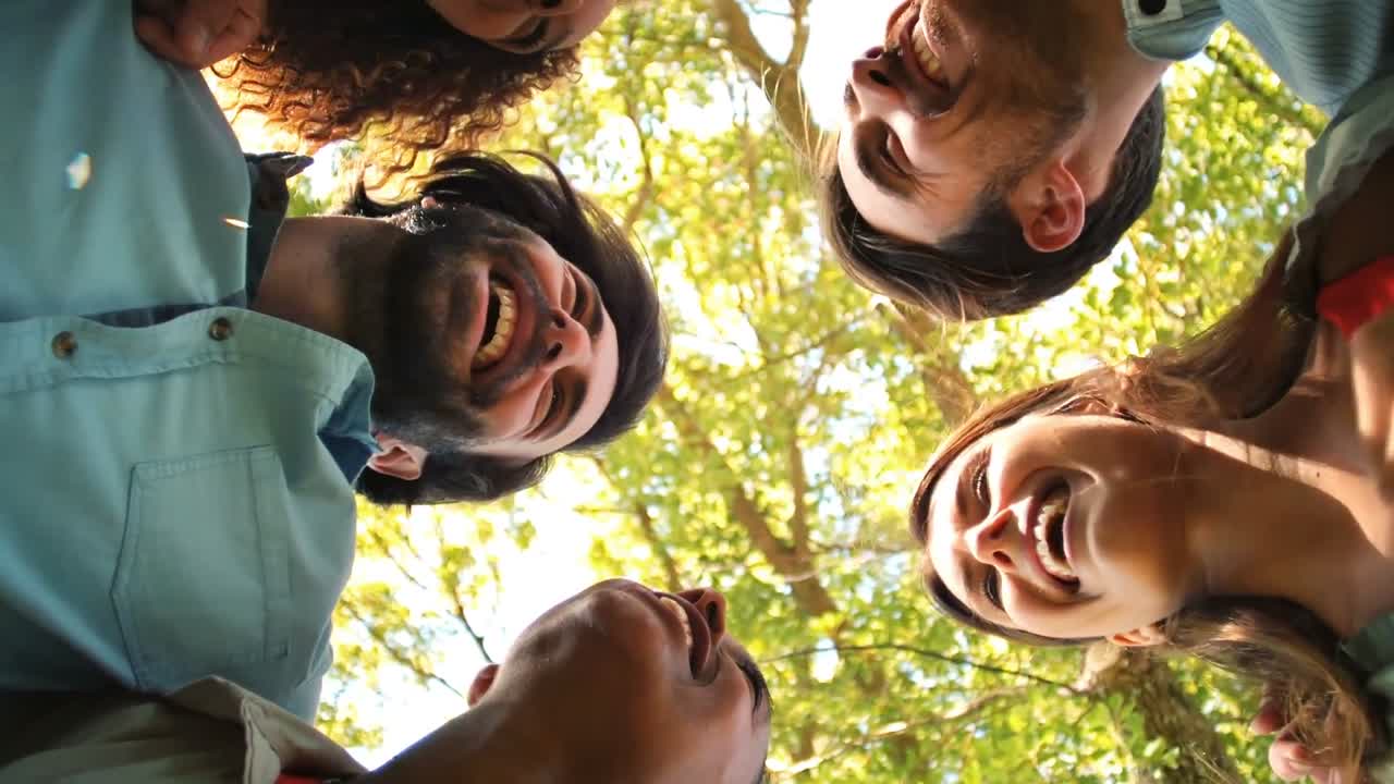 Premium stock video - Group of friends forming huddles