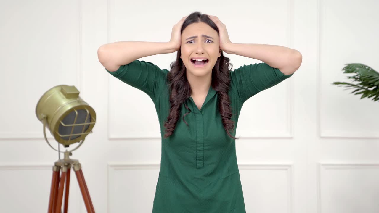 Premium stock video - Shocked indian girl shouting and screaming