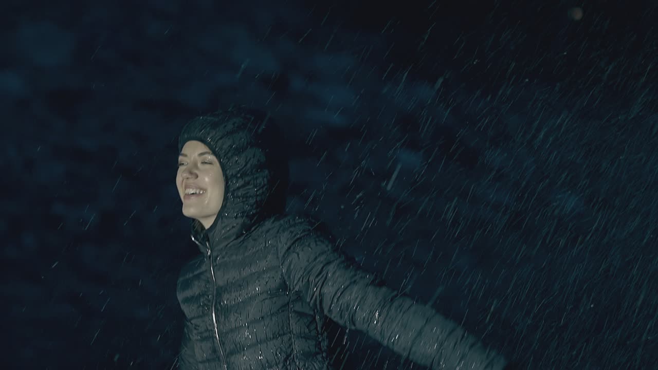 Pretty lady screams with happiness in heavy rain at night | Premium ...