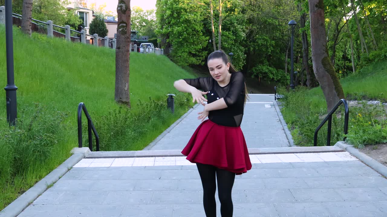 Premium stock video - Attractive female dancer performs a slow dance