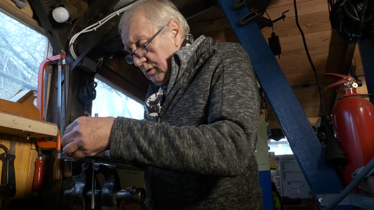 Premium stock video - Senior mechanic uses vernier caliper to measure ...