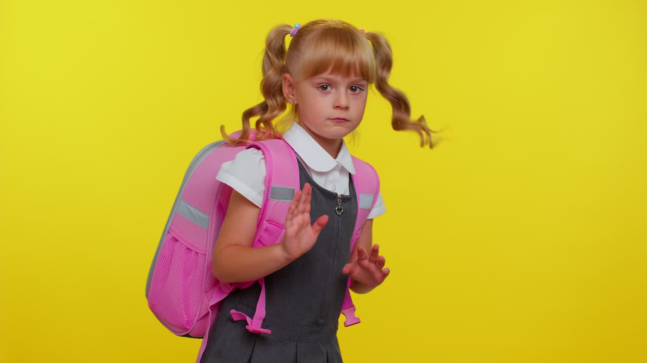 Confused cute schoolgirl kid pointing fingers himself ask say who why ...