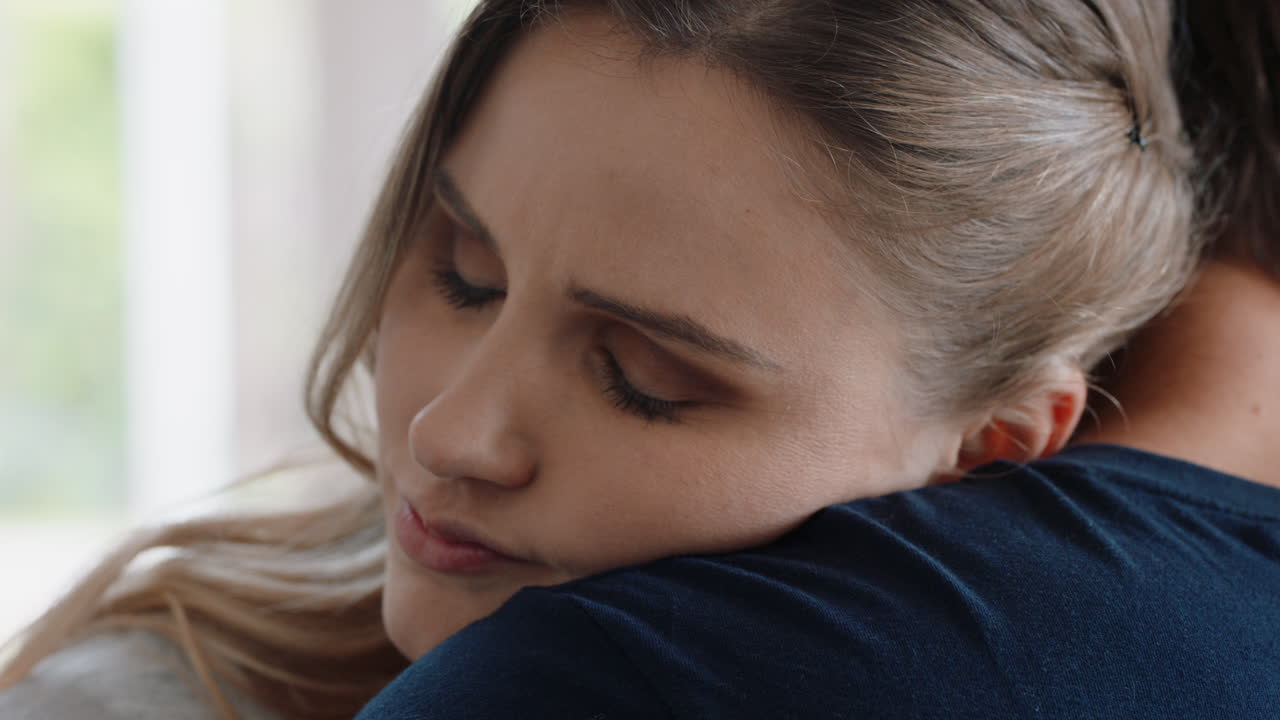 Premium stock video - Sad woman hugging boyfriend young couple having ...