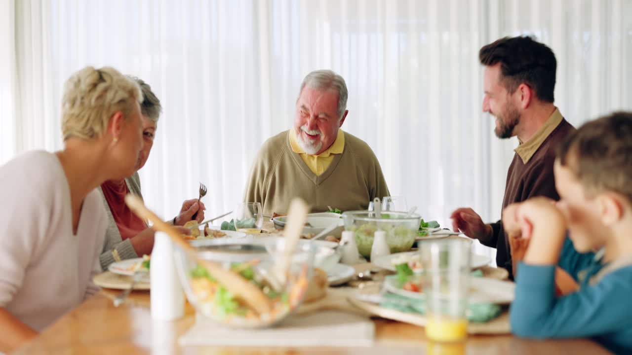 Happy family, lunch and laughing at a dining table | Premium Stock ...