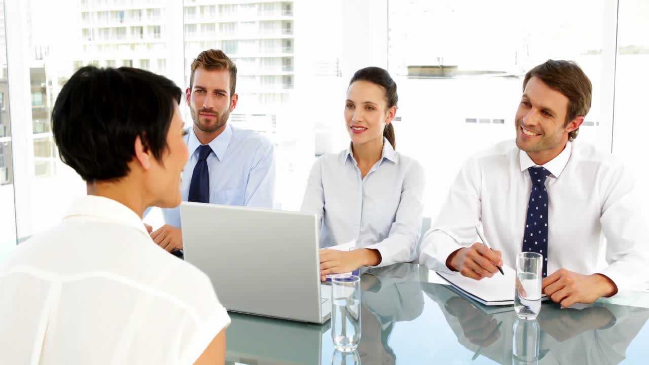 Premium stock video - Interview panel talking to applicant