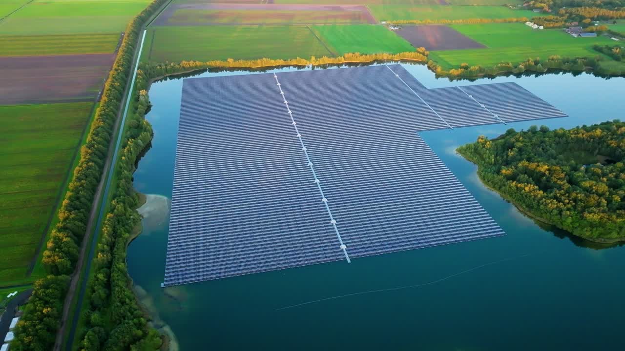 Premium stock video - Big solar farm on lake water generating ...