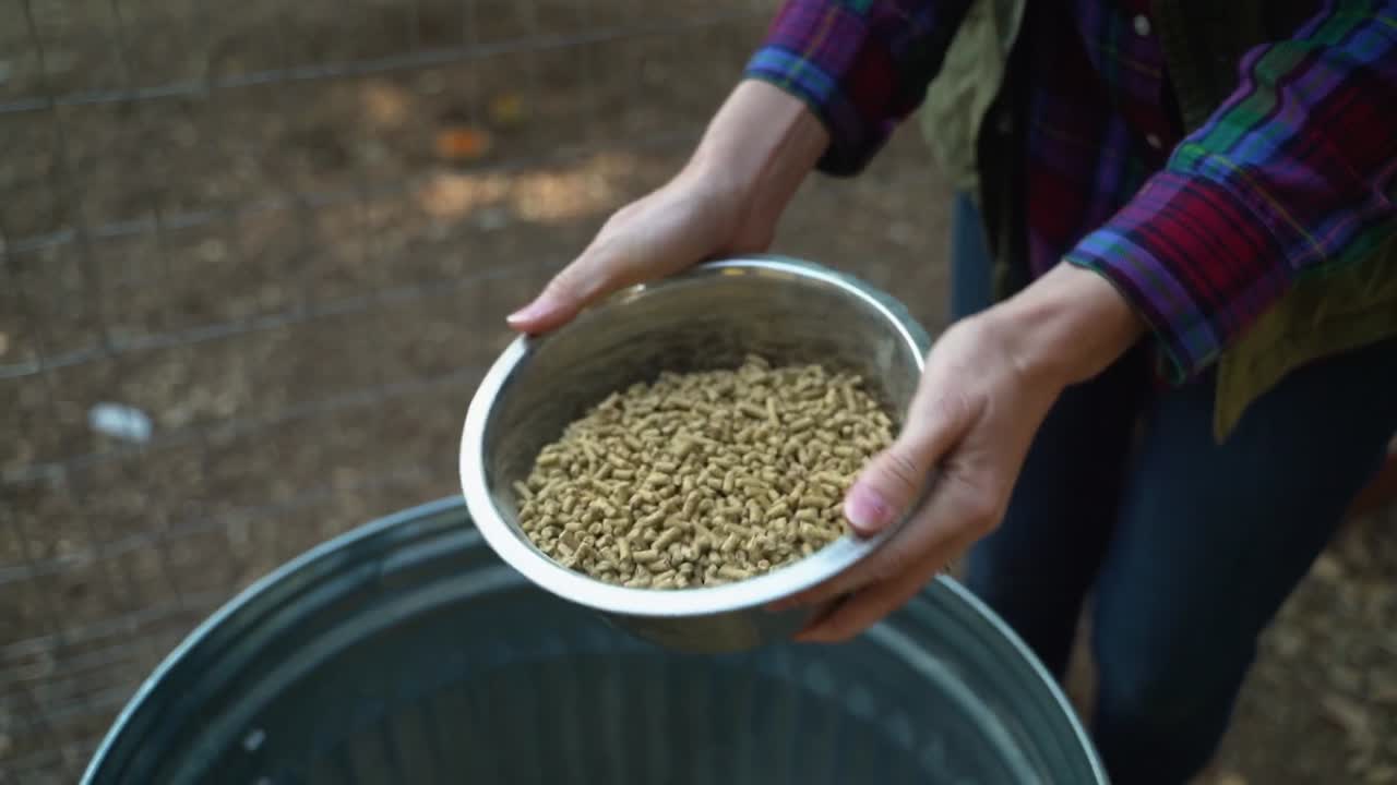 Premium stock video - Cowgirl preparing the food to be served to the ...
