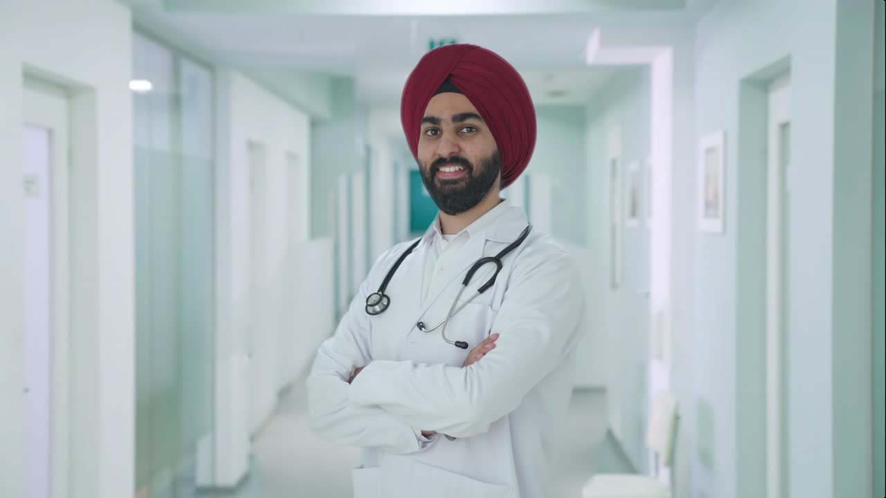 Premium stock video - Portrait of happy sikh indian doctor standing ...