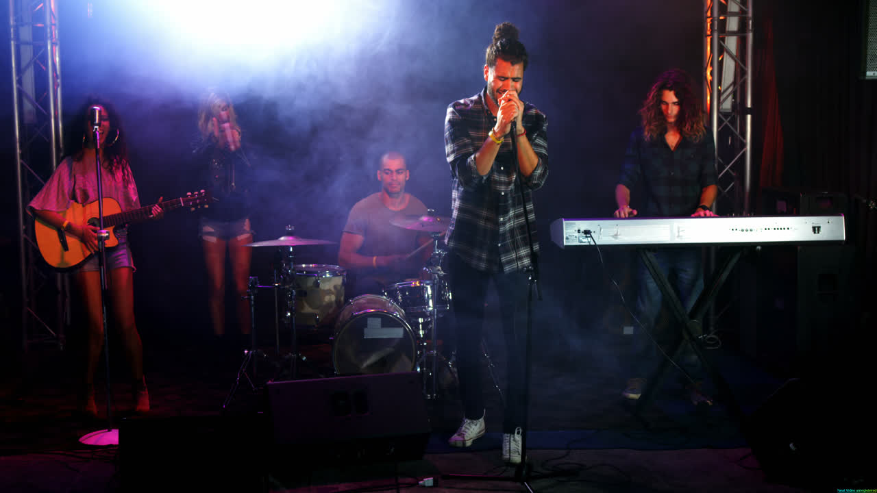 Premium stock video - Singer performing on stage at a concert 4k