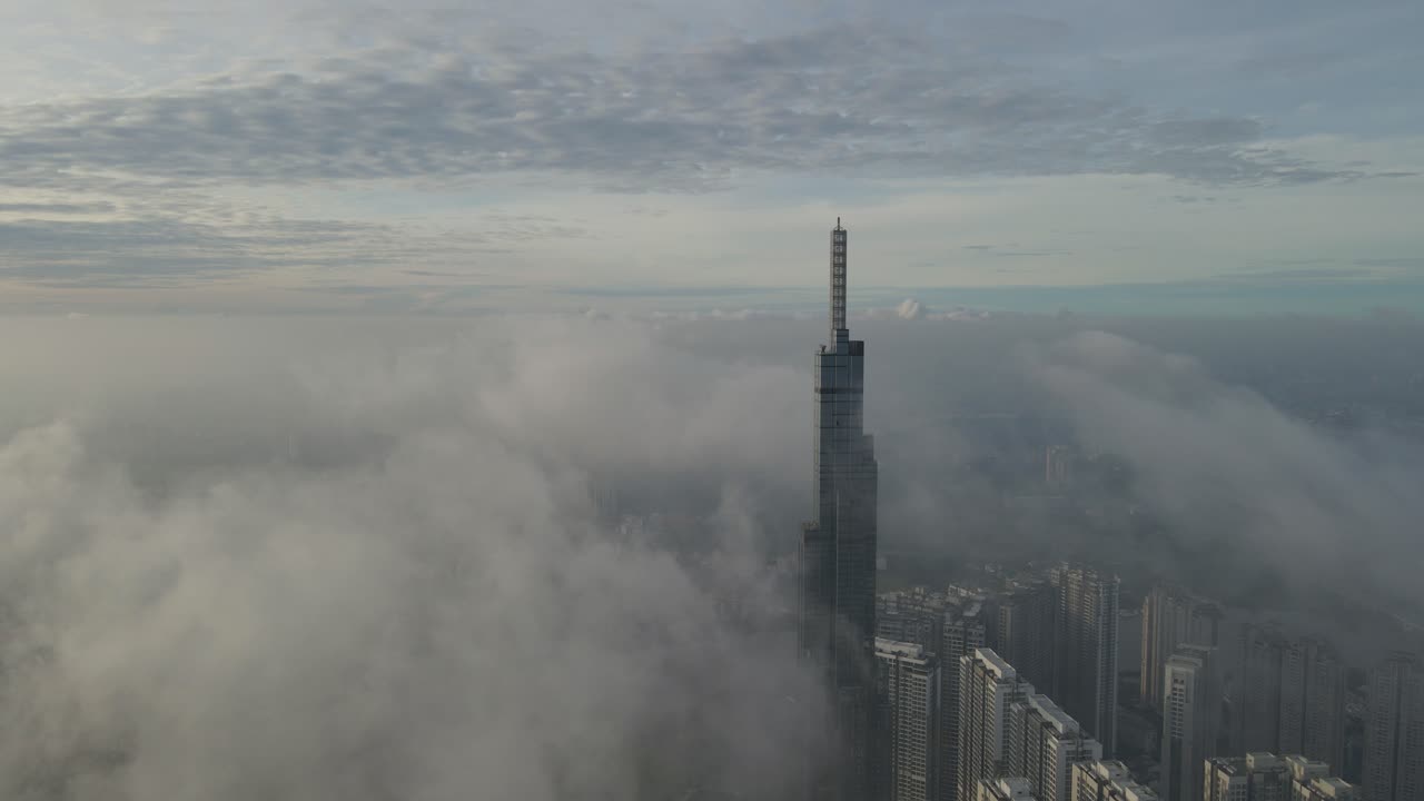 Free stock video - Clouds fly over high-rise buildings in ho chi