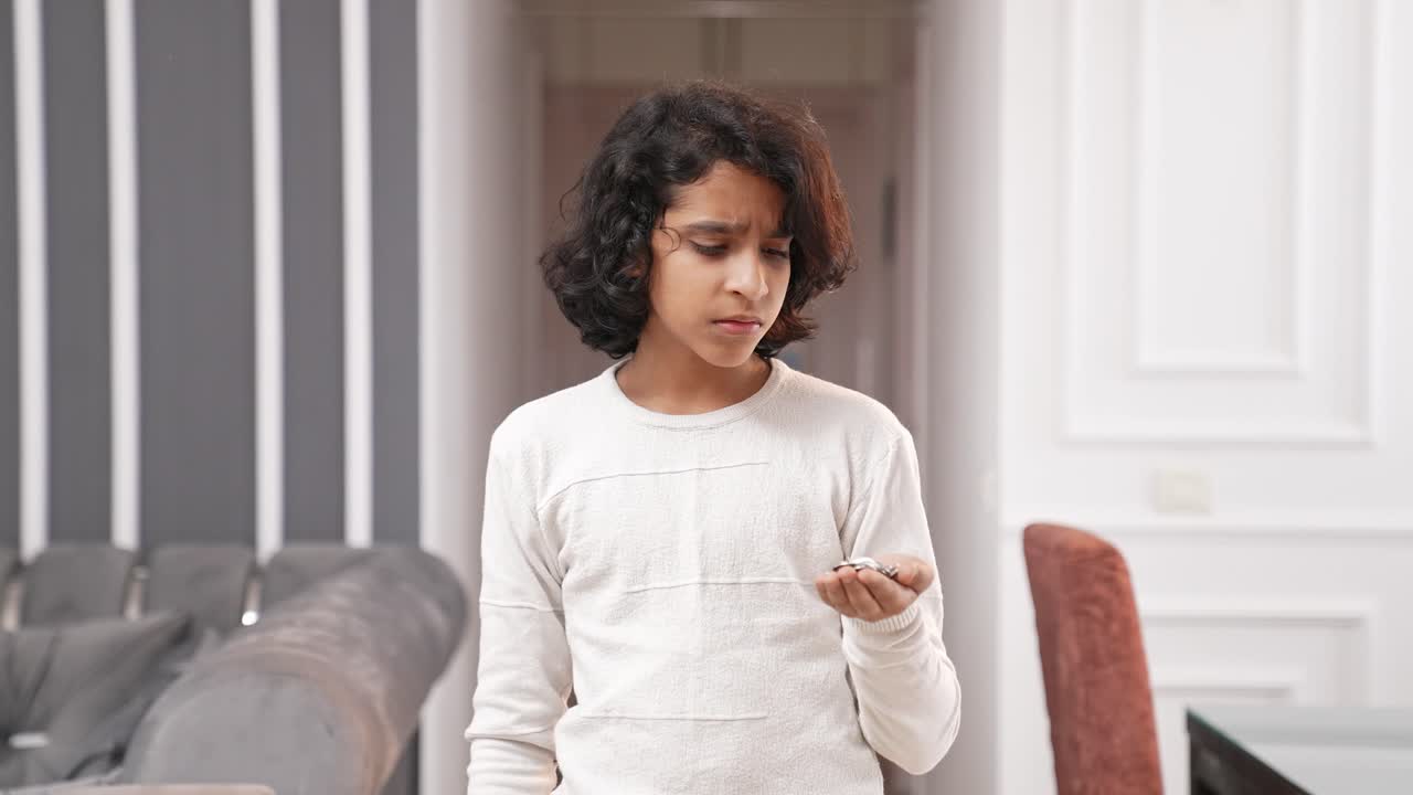 Confused Indian Kid Boy Thinking On What To Do With Money Free Stock ...