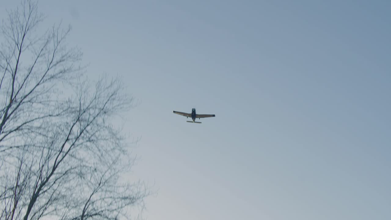 A Small Piper Aircraft Flies Over At Sunset Free Stock Video Footage ...