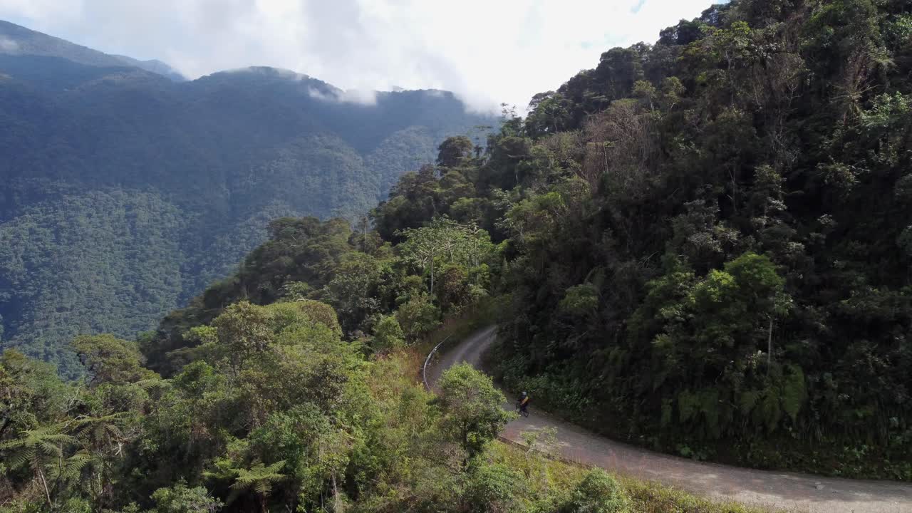 Cyclists Descend World Famous Yungas Road In Steep Mountains, Bolivia ...