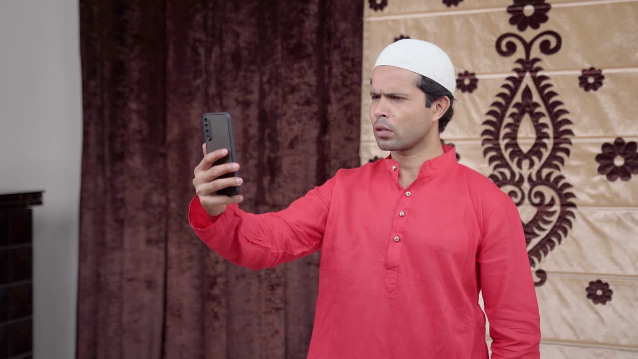 Premium stock video - Angry muslim man talking on a video call