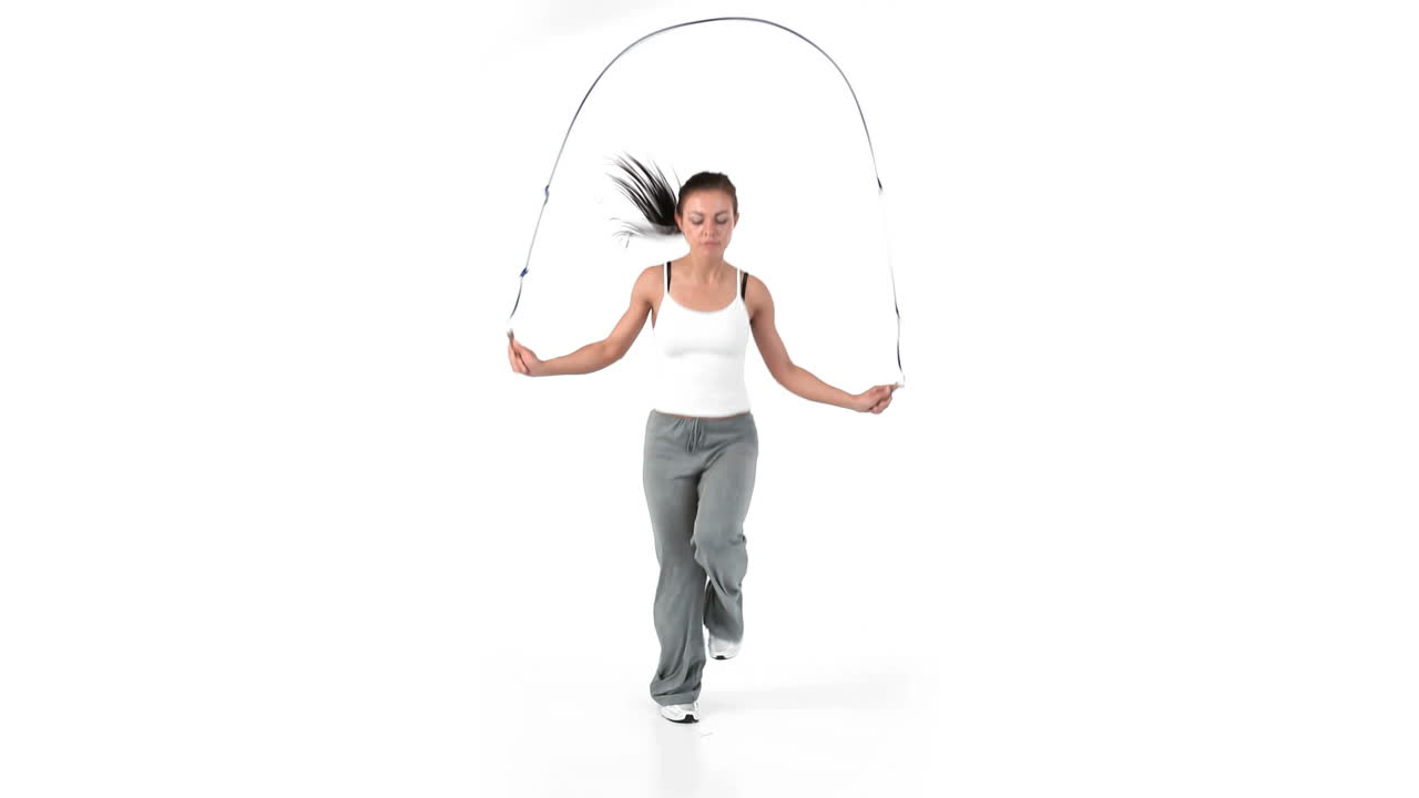Woman jumping with a skipping rope | Premium Stock Video Footage