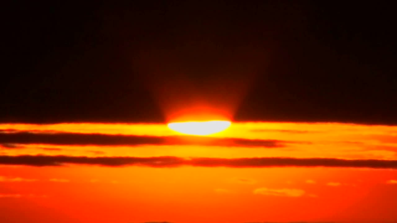 The last rays of sun disappear behind dark clouds Premium Stock Video ...