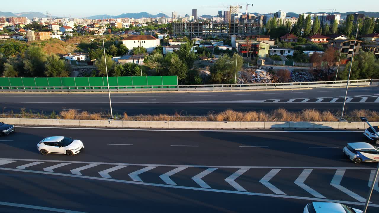 Vehicles driving on Tirana ring road highway, suburban traffic ...