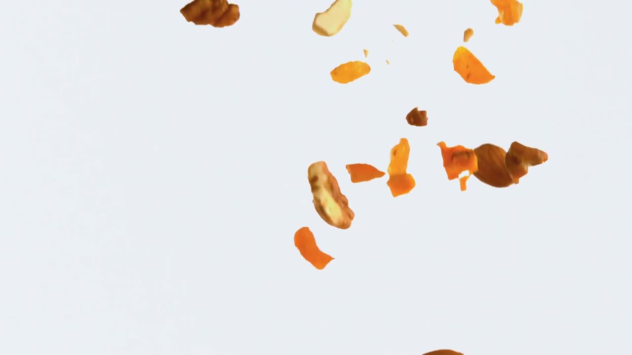 Dry fruits falling against white background 4k | Premium Stock Video ...