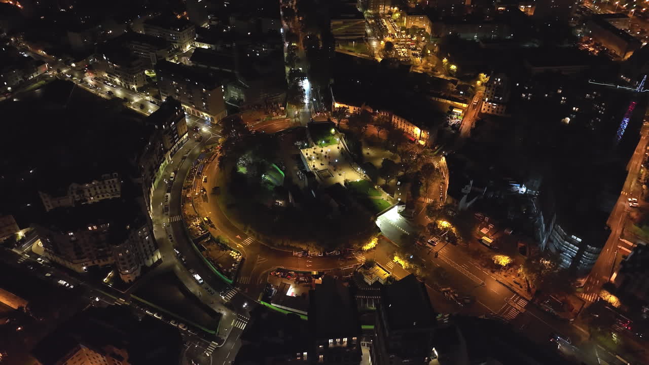 Free stock video - A bird's-eye view: roundabouts dance in the lights ...