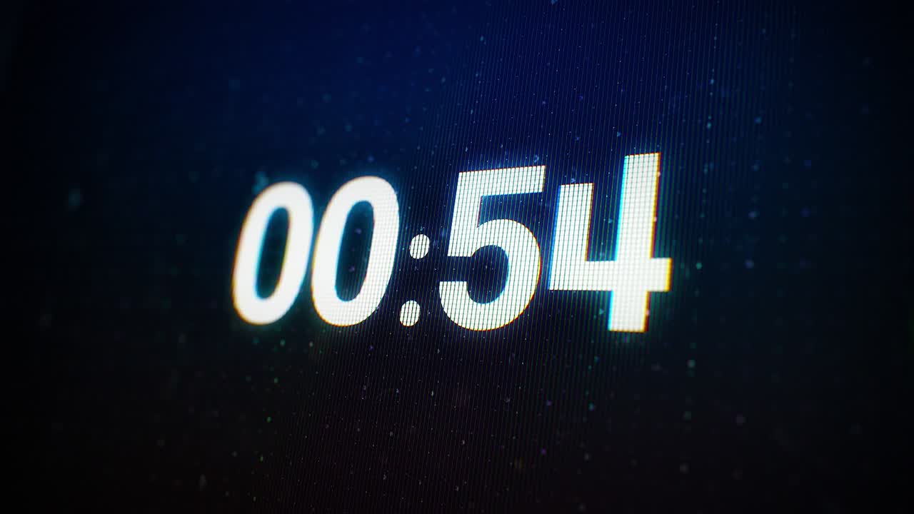Close-up of 60 seconds glitch interference countdown numbers on a computer screen in defocus. 1 ...