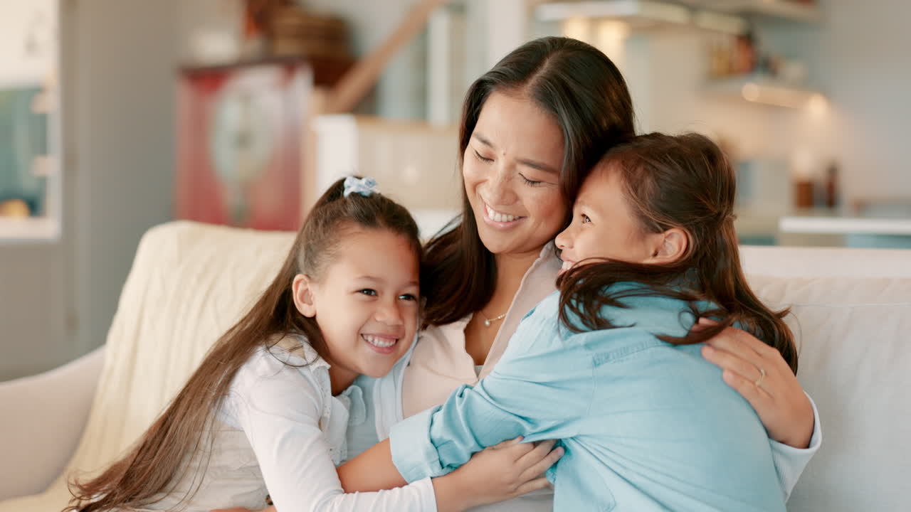 Premium stock video - Mother, couch and hug with kids