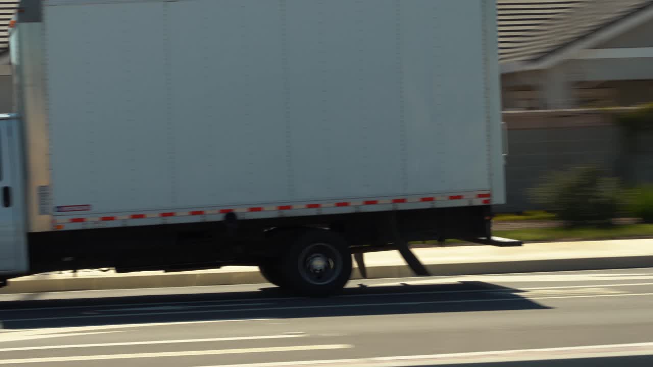 Home Moving And Shipping Company White Box Truck Driving Down A Road To ...