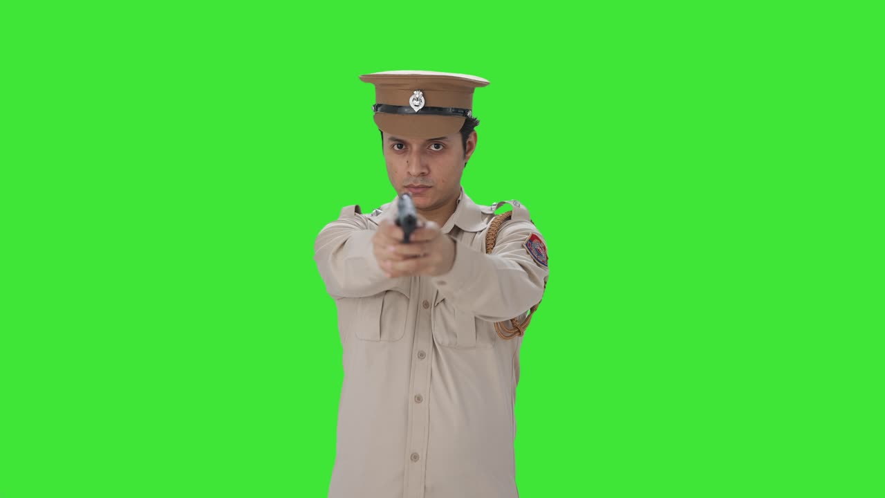 Serious Indian Police Officer Aiming With His Gun Green Screen Free ...
