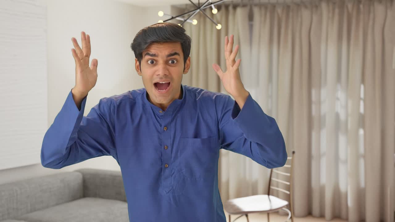 Premium stock video - Frustrated indian man shouting at home