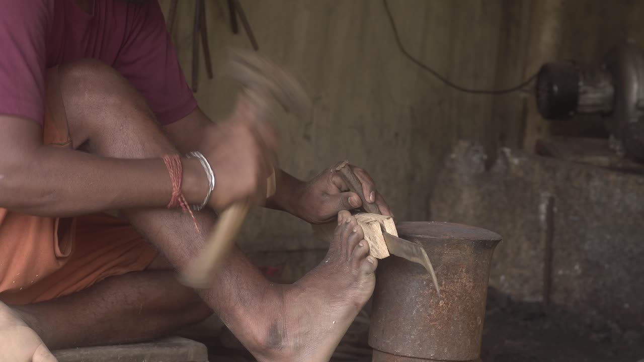 Carpenter finalizing grip holes on a cocunut knife machete | Premium ...