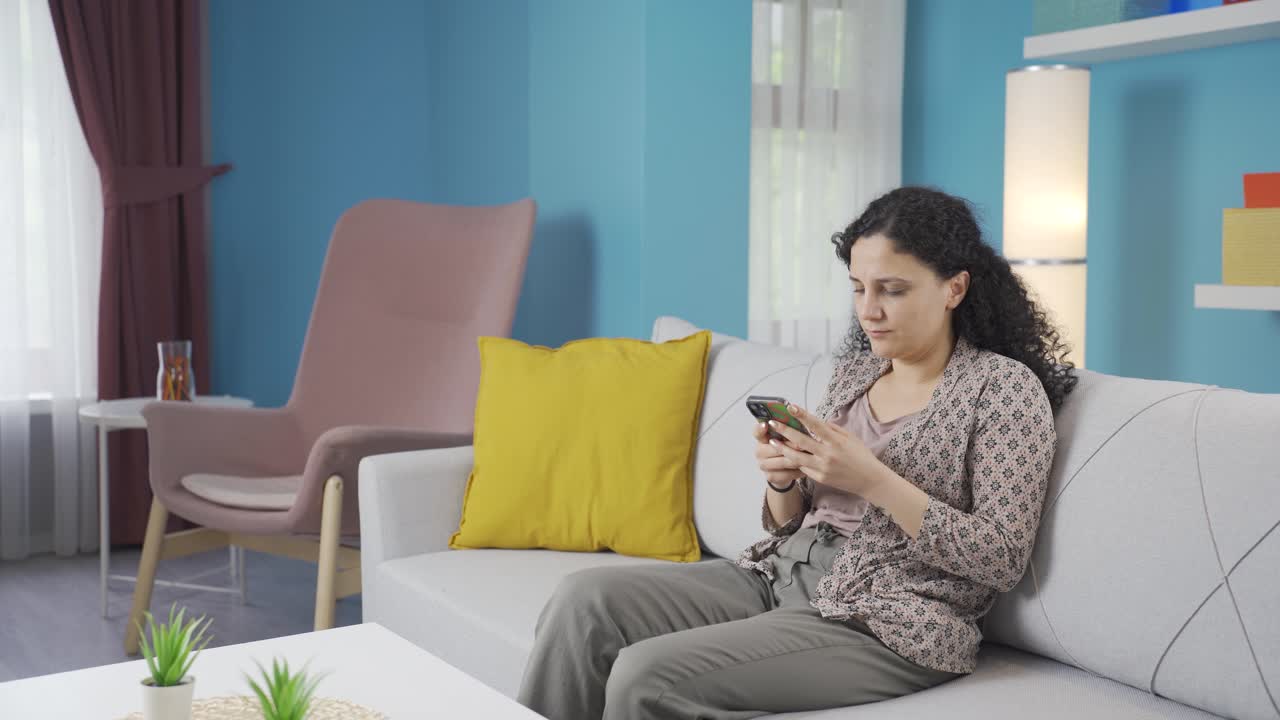 Premium stock video - The young woman arguing in the messaging is angry.