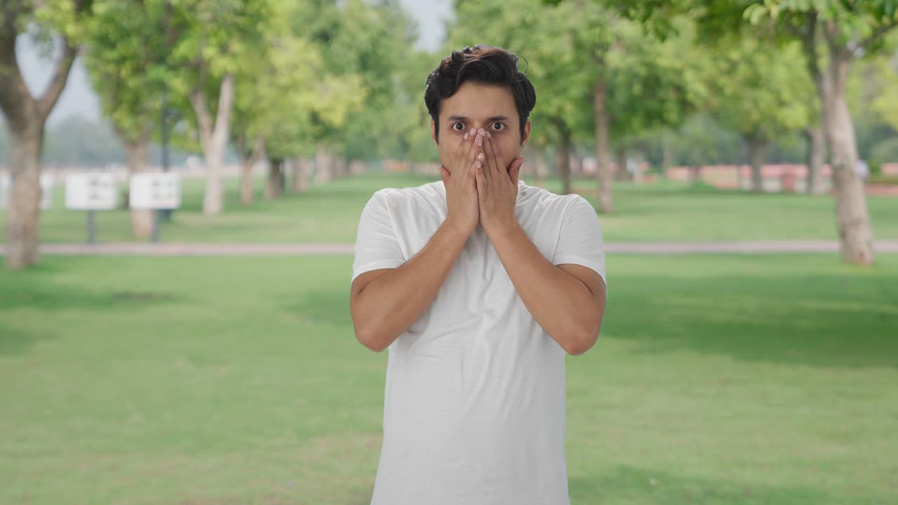 Premium stock video - Indian man sees something bad and shocking